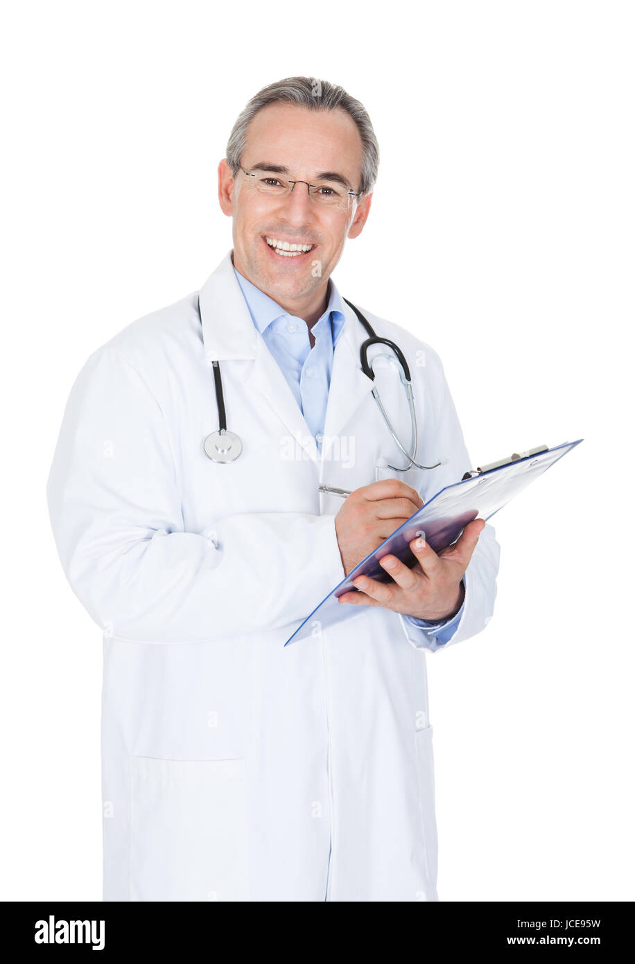 Portrait of a happy doctor writing on clipboard Stock Photo - Alamy
