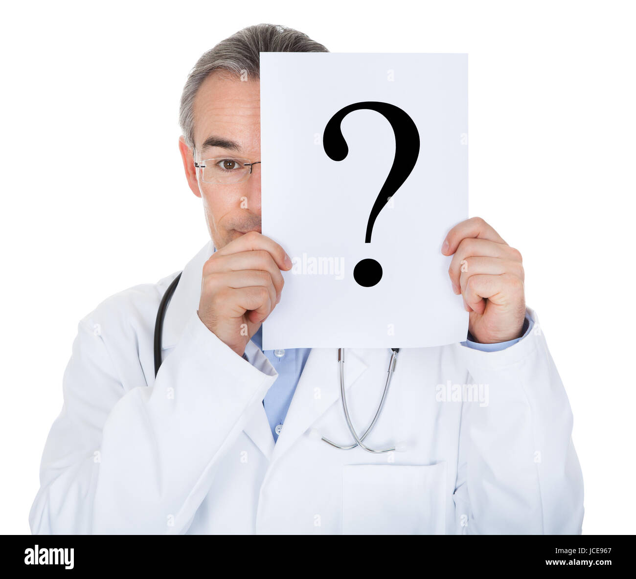 Portrait of doctor holding paper with question mark isolated on white ...