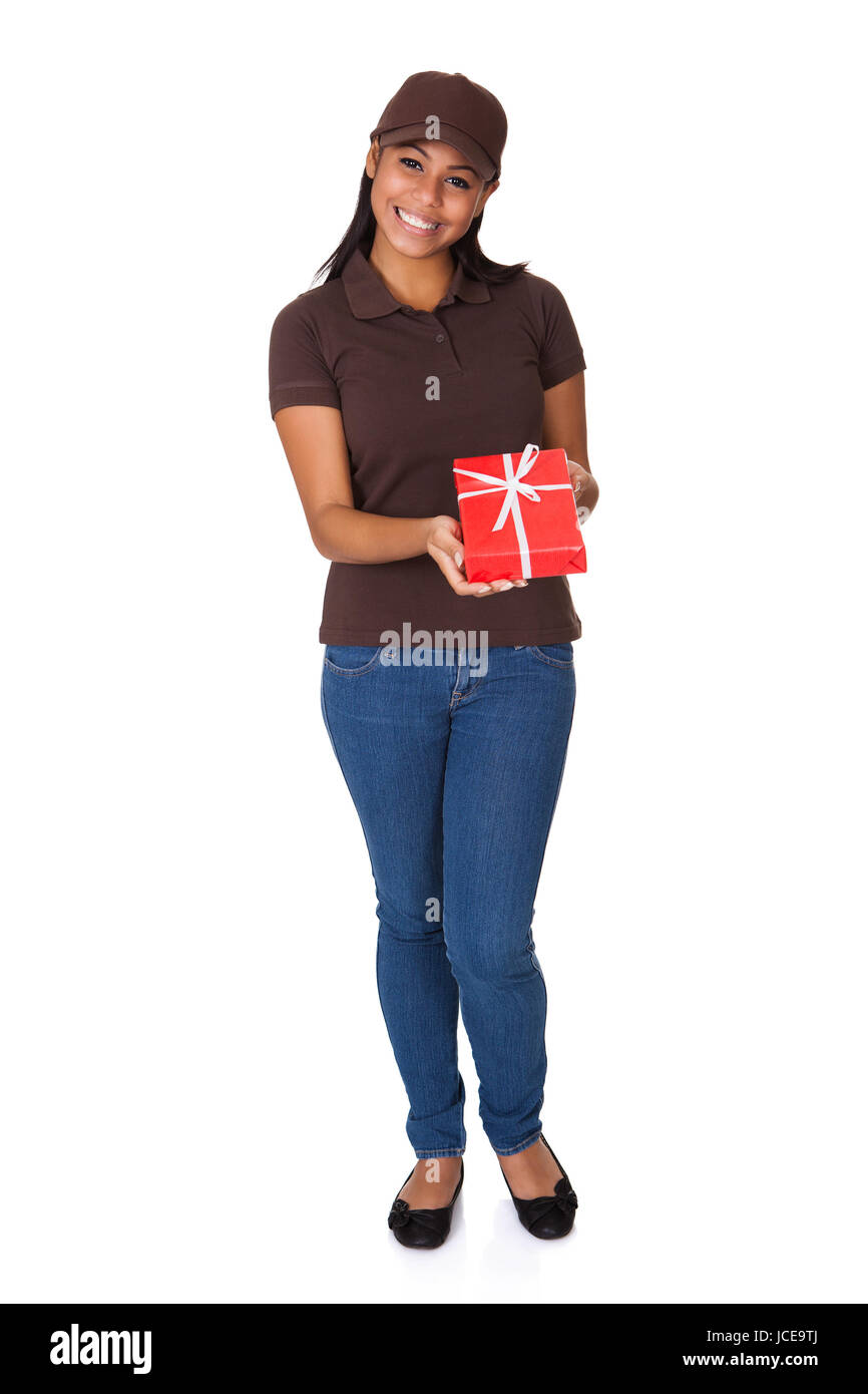 Young Woman Giving Gift Box. Isolated On White Stock Photo - Alamy