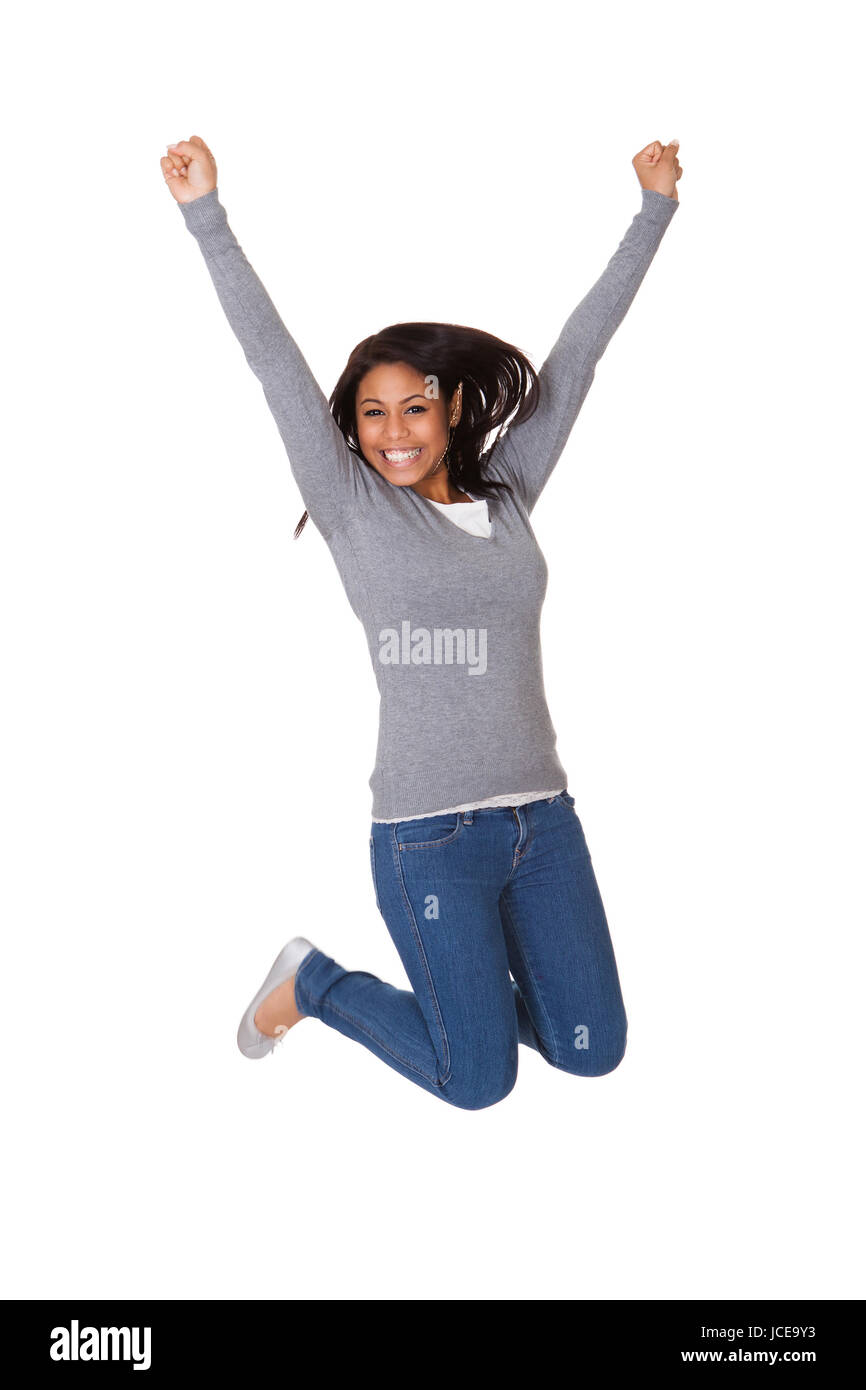 Portrait Of Excited Young Woman Jumping. Isolated On White Stock Photo ...