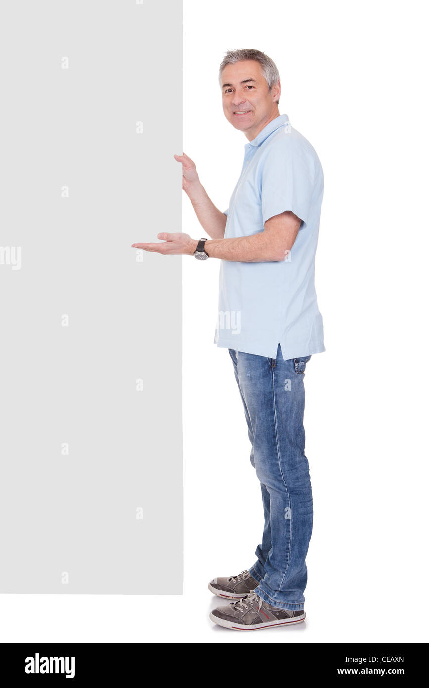 Man Presenting Blank Placard Over White Background Stock Photo - Alamy