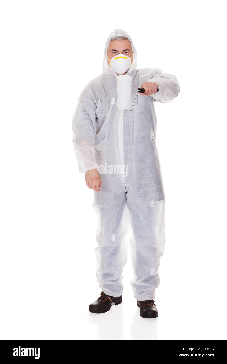 Man Holding Painting Roller Over White Background Stock Photo - Alamy