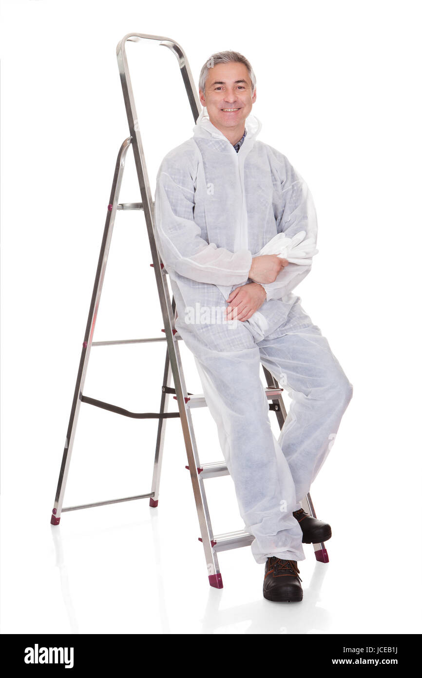 Mature Man Sitting On Ladder Over White Background Stock Photo - Alamy
