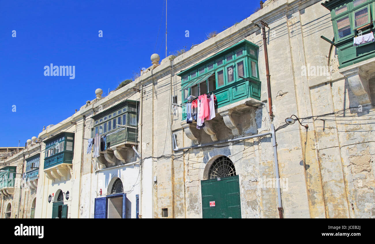 Old merchant house with balcony above warehouse area, Valletta, Malta ...