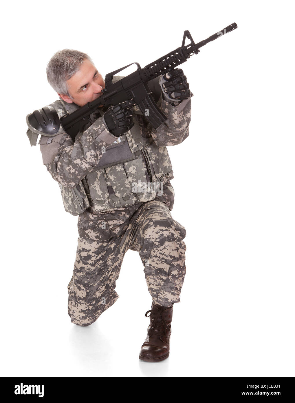 Army soldier uniform weapon holding kneeling military hi-res stock ...