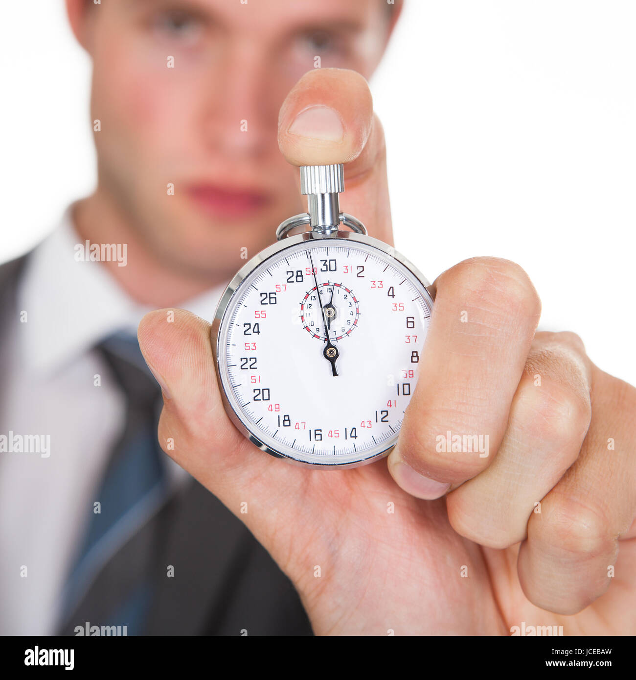 Young Businessman Holding Stopwatch On White Background Stock Photo - Alamy