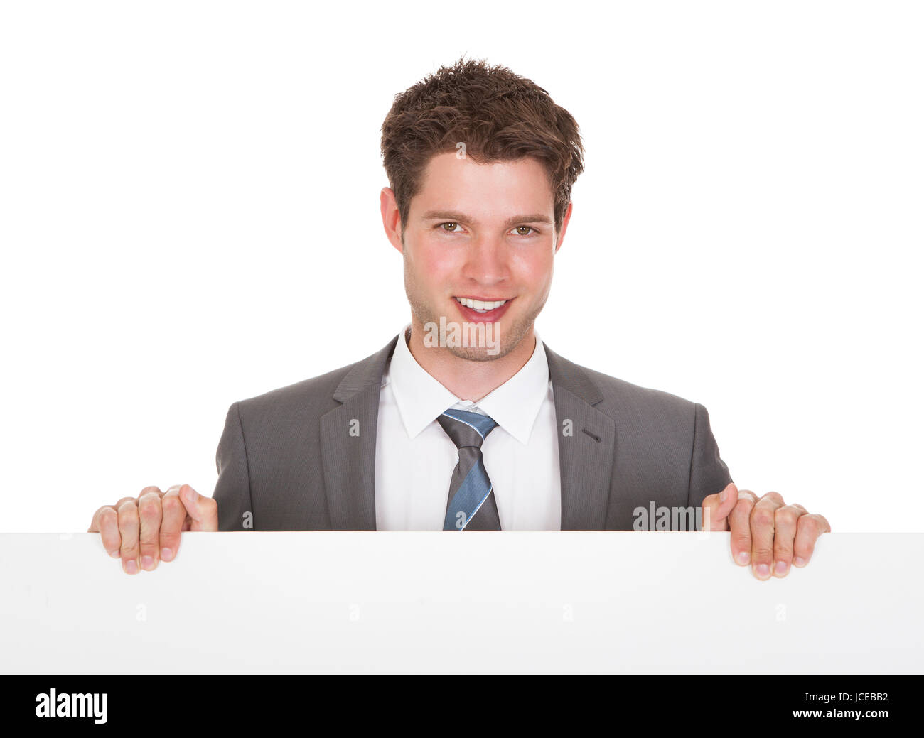 Happy Young Businessman Presenting Blank Placard Over White Background ...