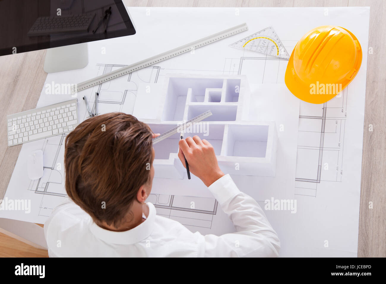 Portrait Of Young Architect Holding Architectural Model Stock Photo - Alamy