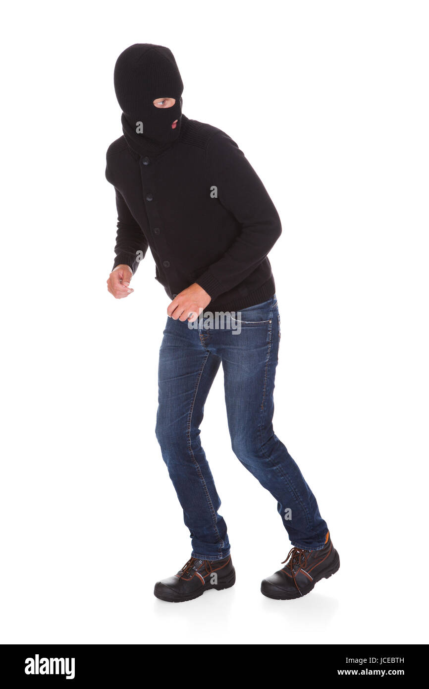 Portrait Of A Burglar Standing Isolated On White Background Stock Photo ...