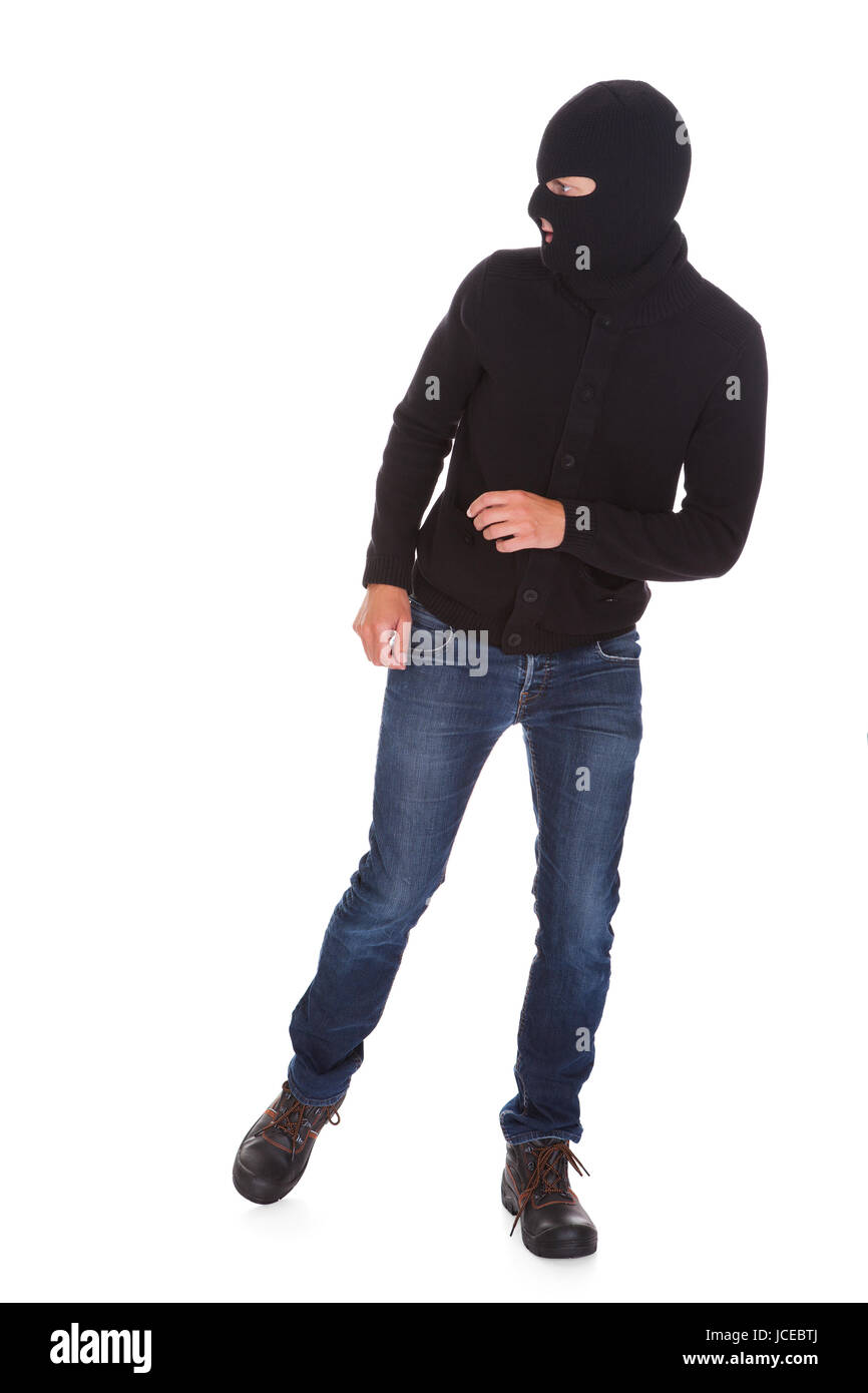Portrait Of A Burglar Standing Isolated On White Background Stock Photo ...