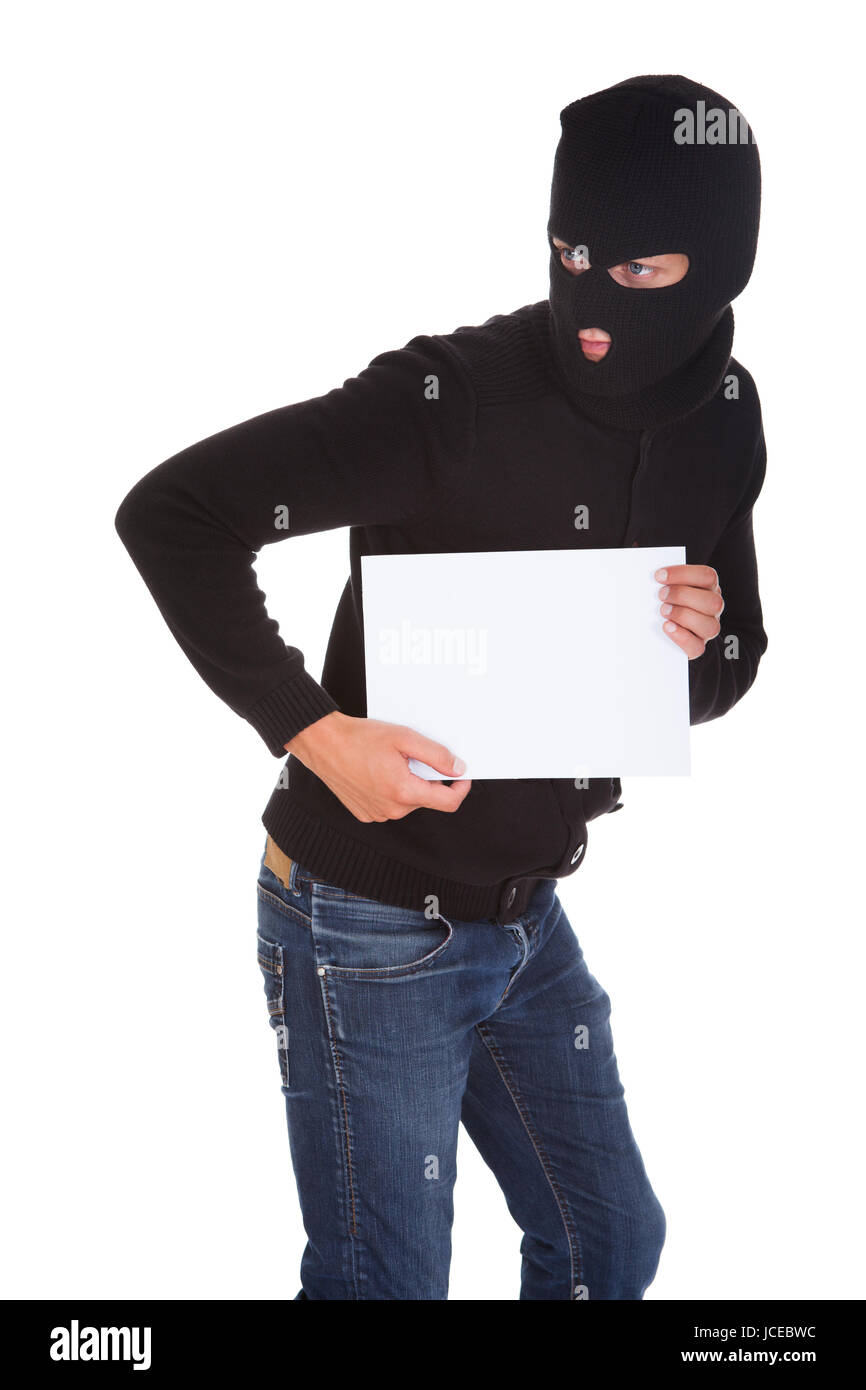 Burglar Man Holding Blank Placard And Looking Back Over White ...