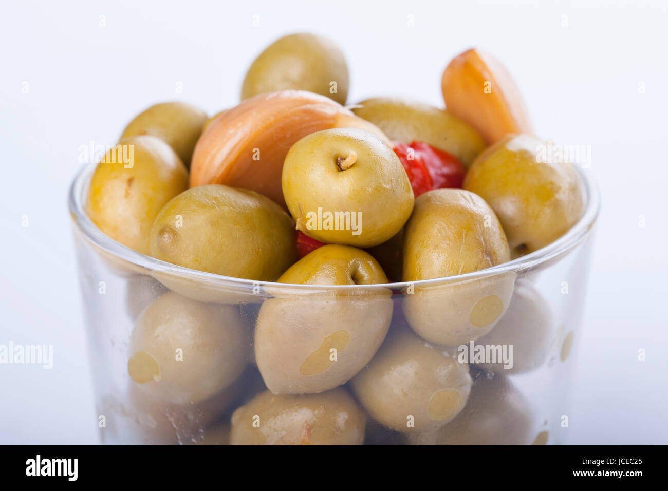 a handful of homemade olives on a glass, typical spanish tapa, isolated ...