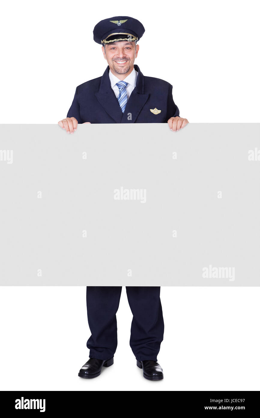 Portrait Of Happy Pilot Holding Blank Placard On White Background Stock ...