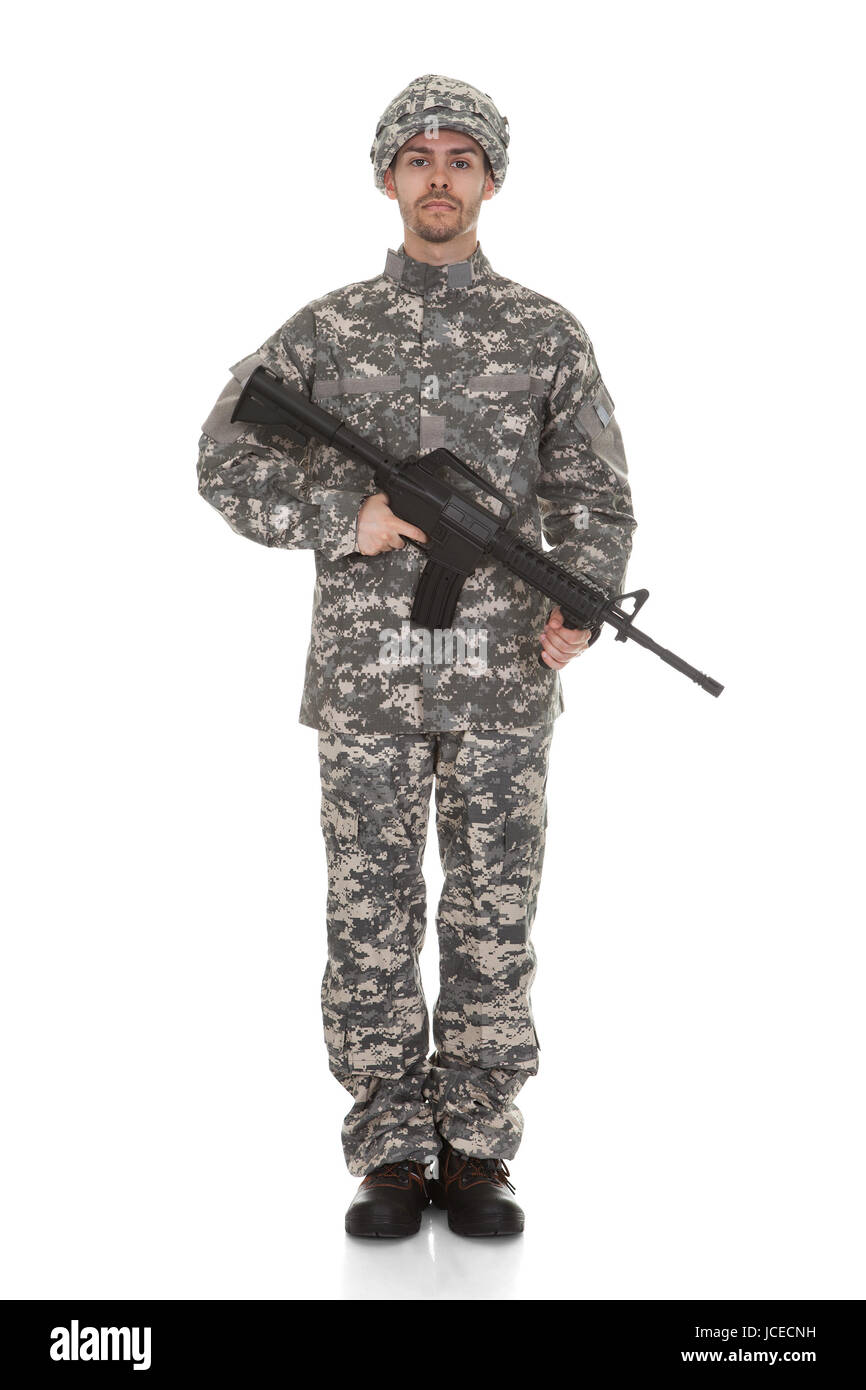 Portrait Of Soldier Holding A Gun Over White Background Stock Photo - Alamy