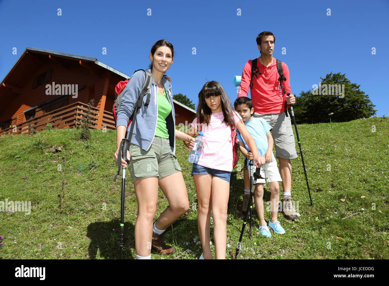 Parents and kids on a trekking day in the mountain Stock Photo - Alamy