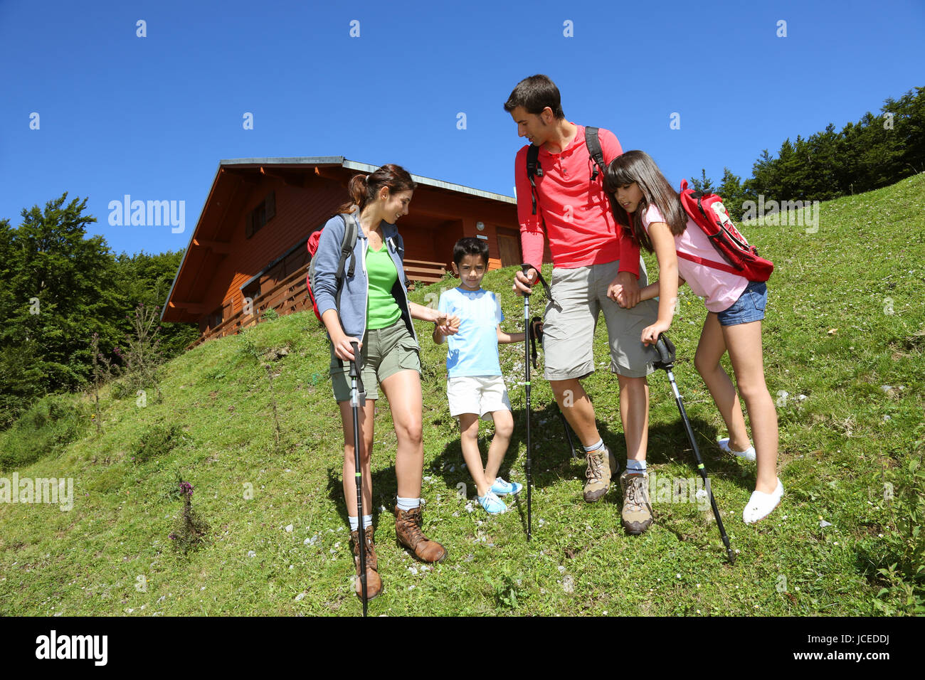 Parents and kids on a trekking day in the mountain Stock Photo - Alamy