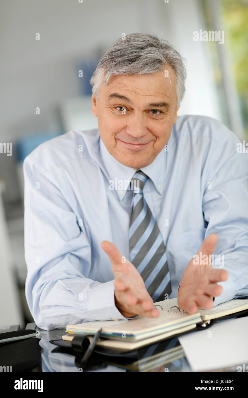 Senior businessman meeting client in office Stock Photo - Alamy