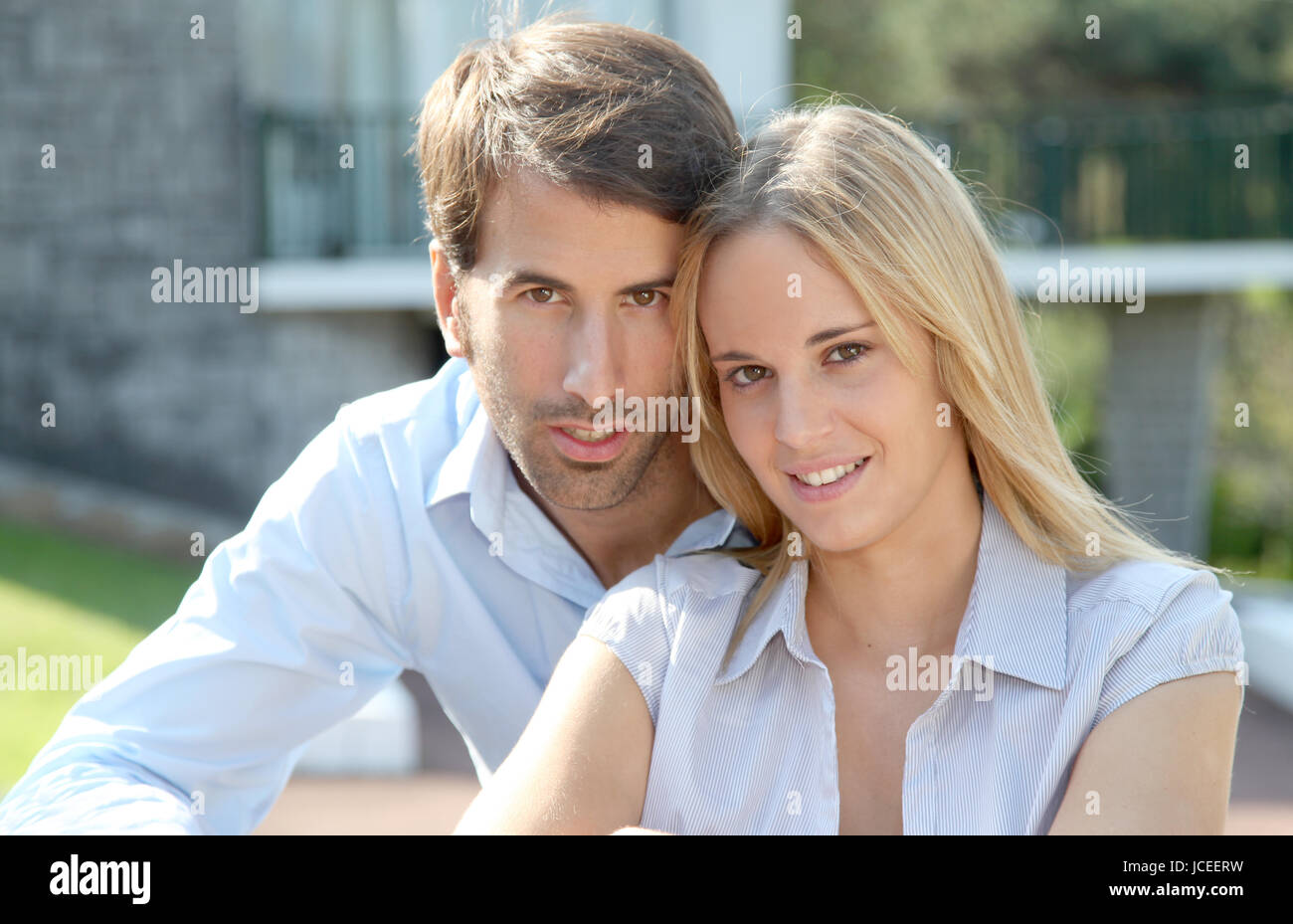 Portrait of happy young property owners Stock Photo - Alamy