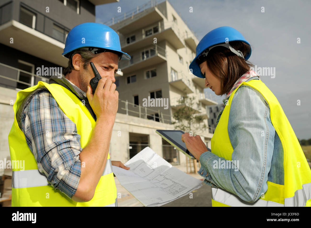 Engineers working on construction site Stock Photo - Alamy