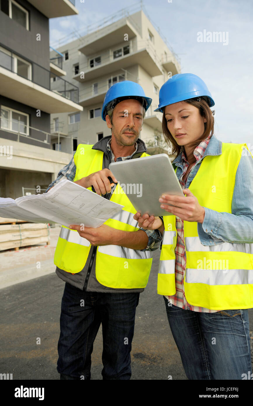 Engineers working on construction site Stock Photo - Alamy