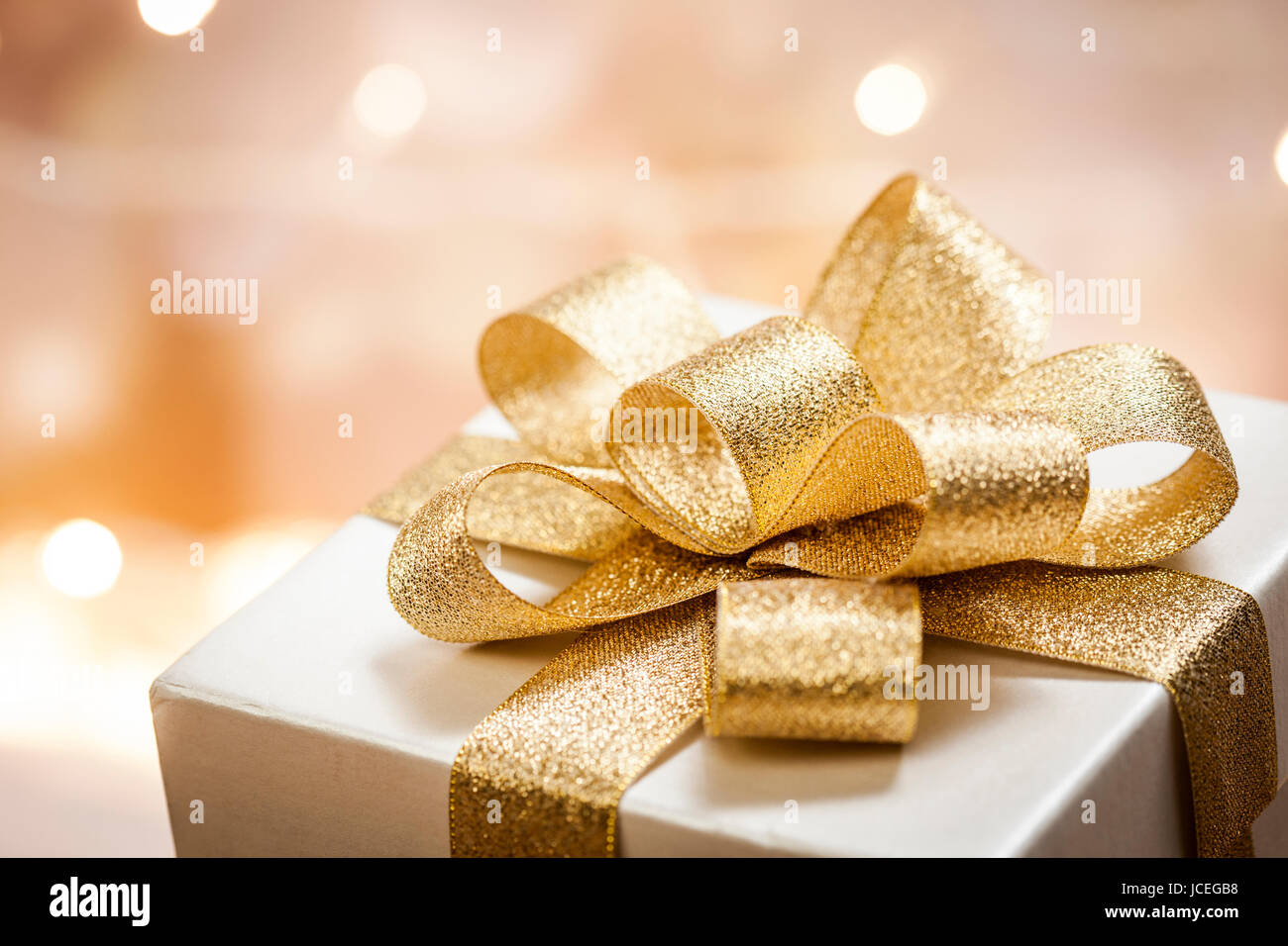 Present box with ribbon Stock Photo - Alamy