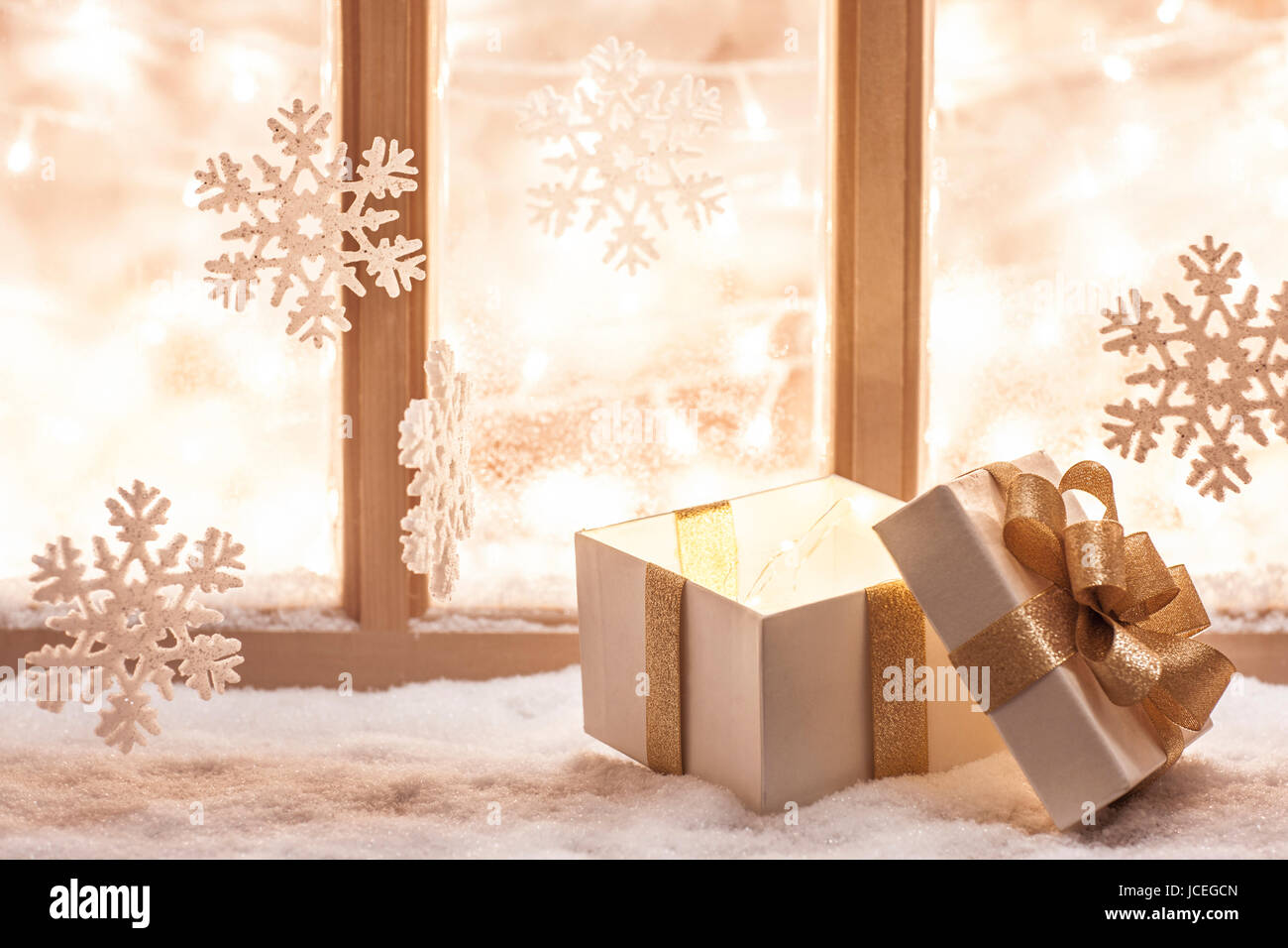 Open present box at window in winter Stock Photo - Alamy