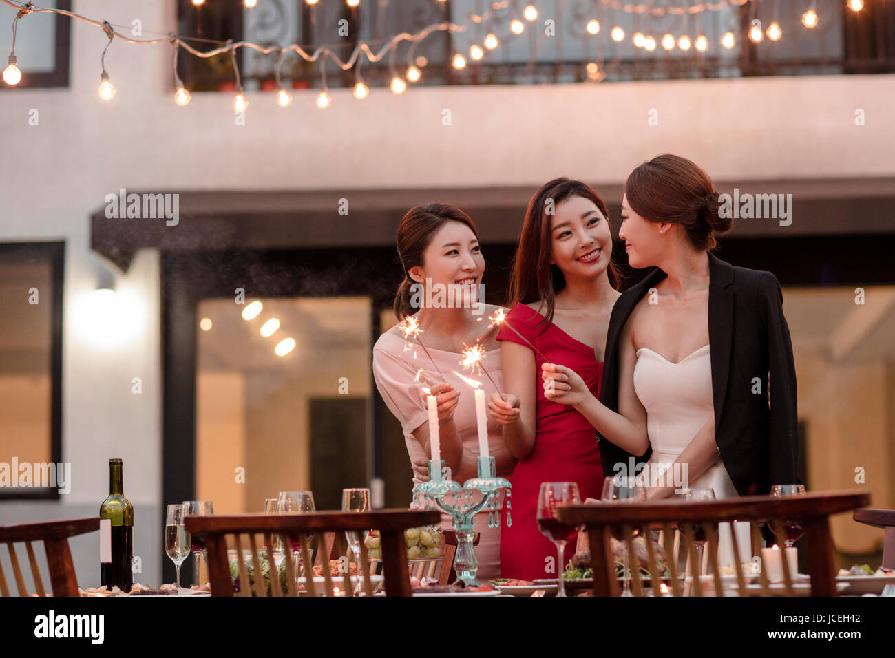 Three smiling women at party Stock Photo - Alamy