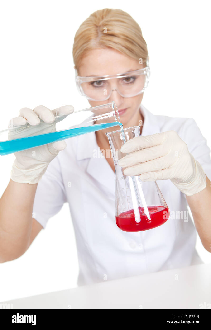 Female scientist mixing chemical solution hi-res stock photography and ...
