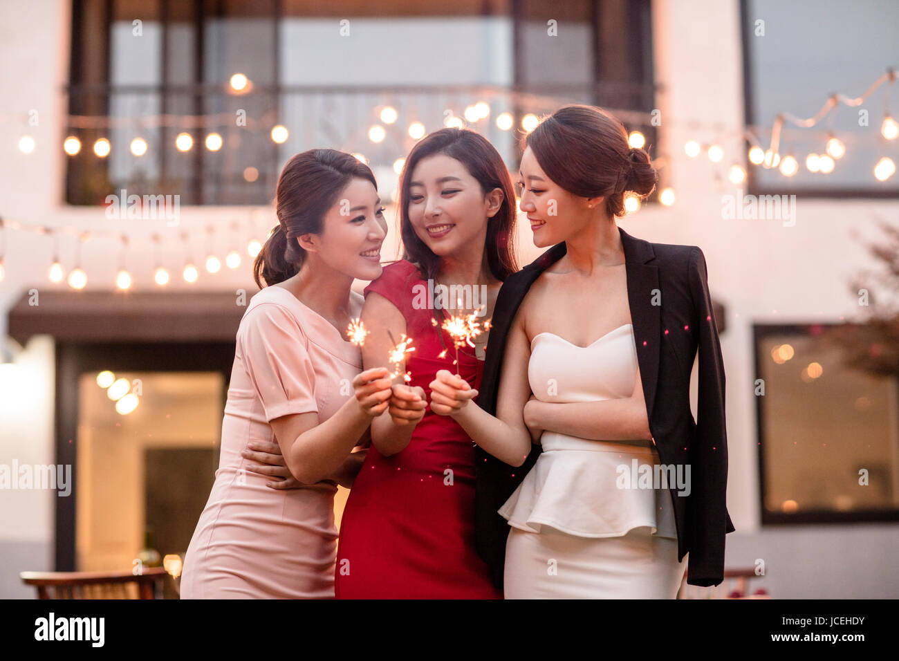 Three smiling women at party Stock Photo - Alamy