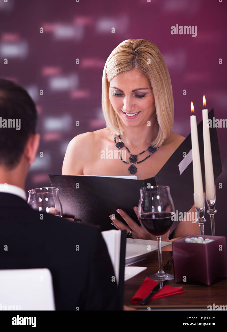 Beautiful blonde lady eating restaurant hi-res stock photography and ...