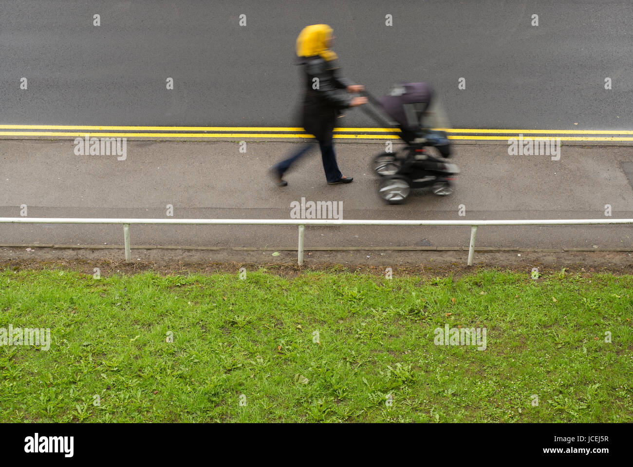 Double yellow lines for parking restriction on urban road with pavement ...