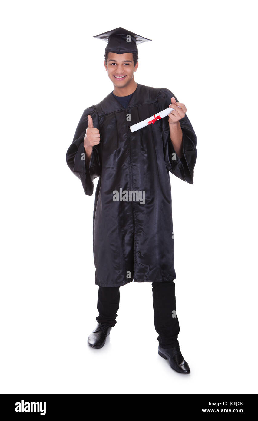 Cheerful young graduation man. Isolated on white Stock Photo - Alamy