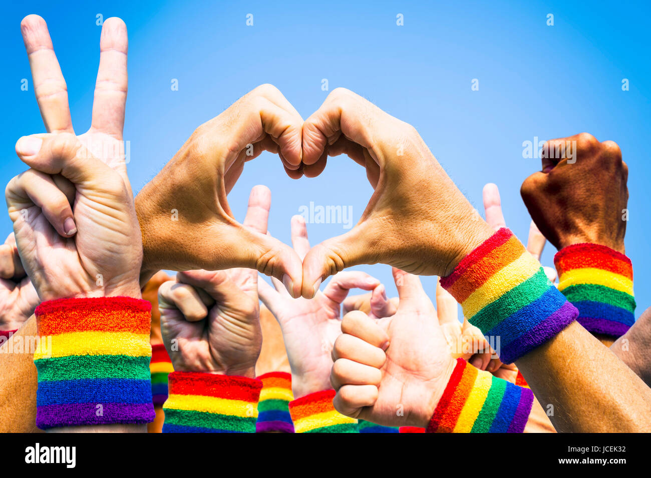 Crowd of hands making supportive signals at gay pride parade Stock ...