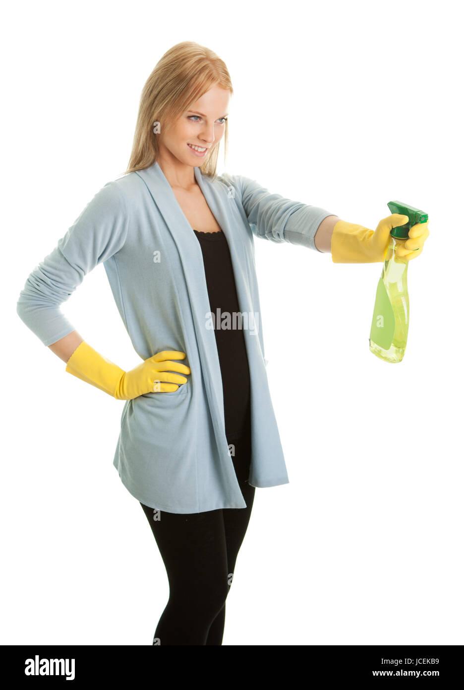 Cheerful young lady spraying cleaner liquid. Isolated on white Stock ...