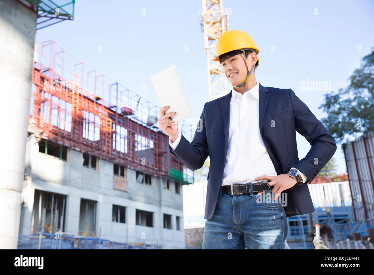 Smiling architect at construction site Stock Photo - Alamy