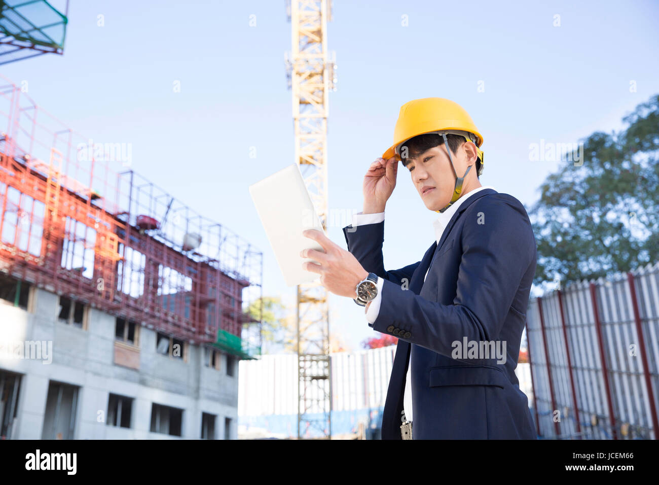 Portrait of architect at construction site Stock Photo - Alamy