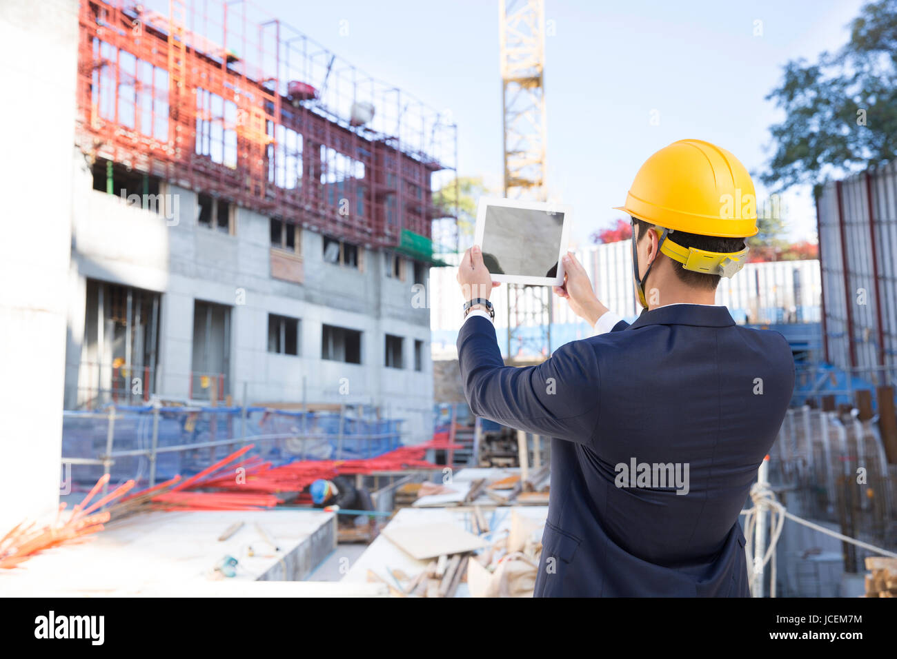Back portrait of architect at construction site Stock Photo - Alamy