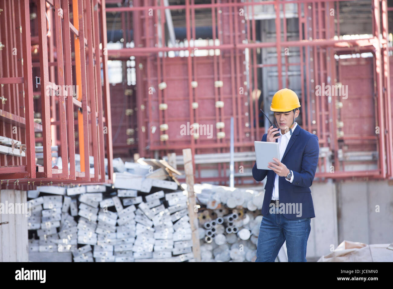 Architect at construction site Stock Photo - Alamy