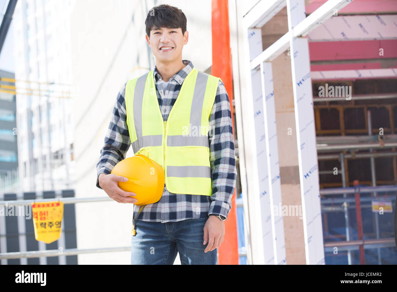 Smiling male construction worker Stock Photo - Alamy