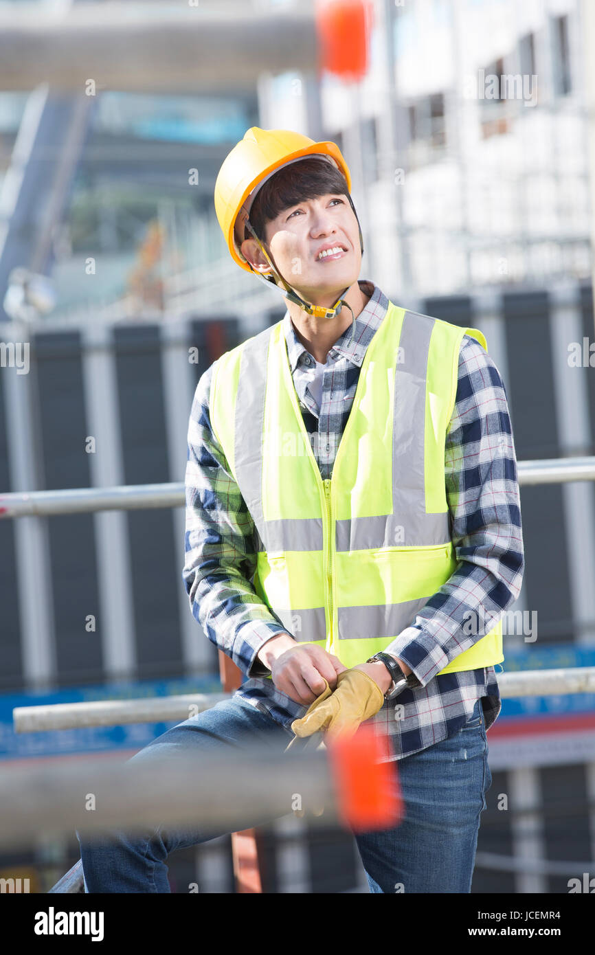 Smiling male construction worker Stock Photo - Alamy