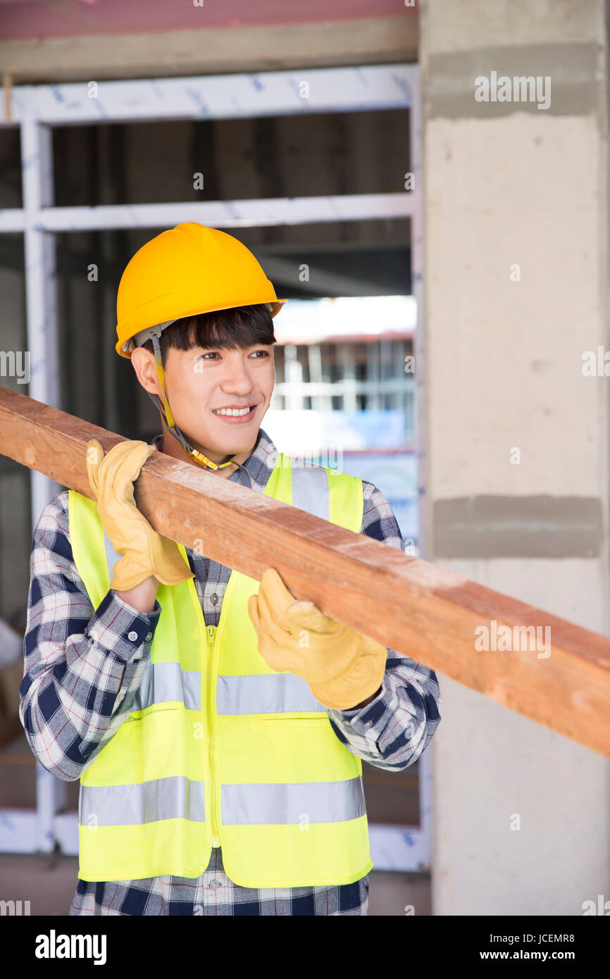 Smiling construction worker Stock Photo - Alamy