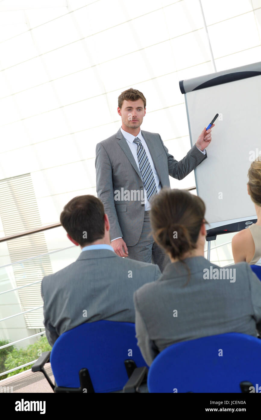 Group of people attending business presentation Stock Photo - Alamy