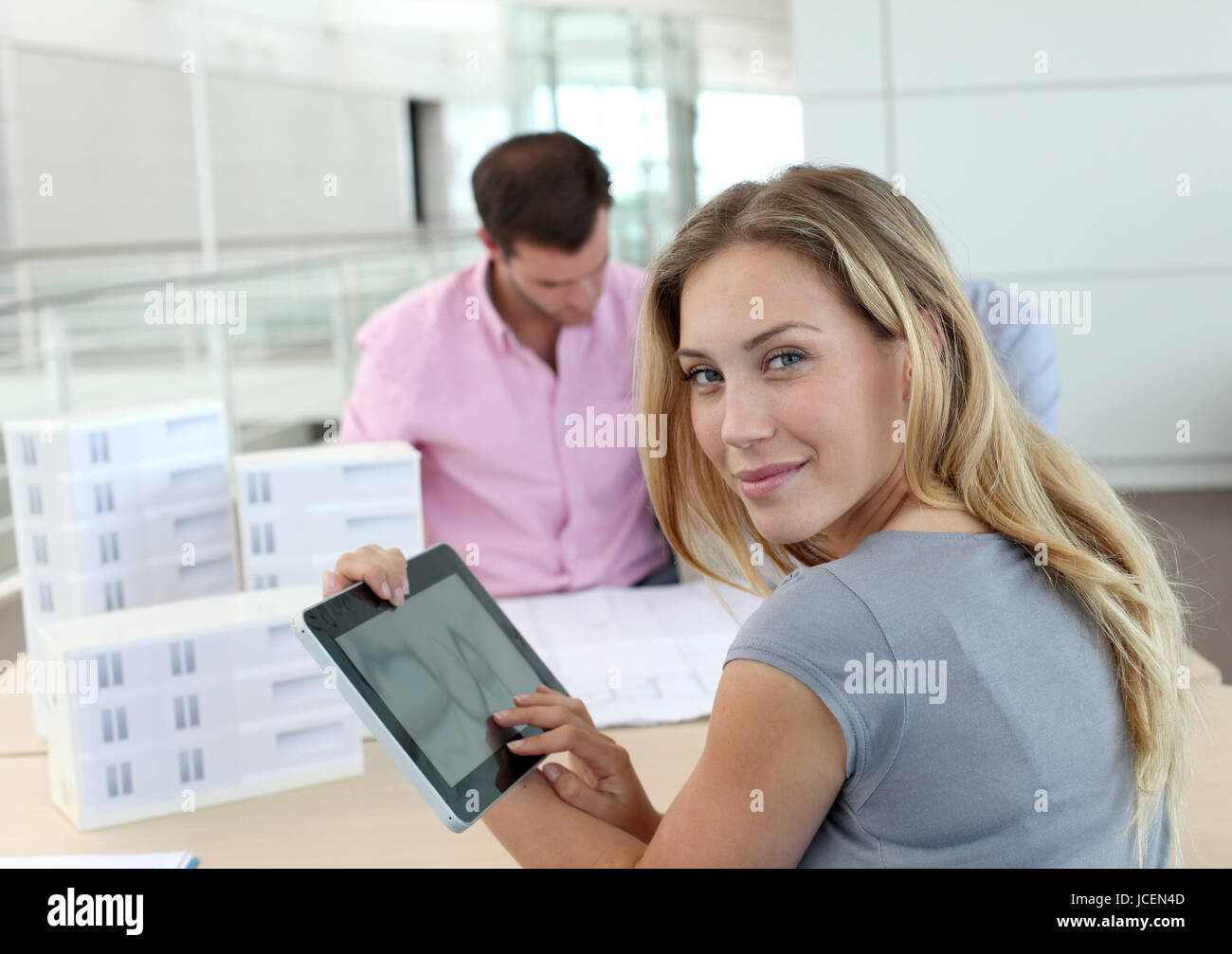 Beautiful woman in office using electronic tablet Stock Photo - Alamy
