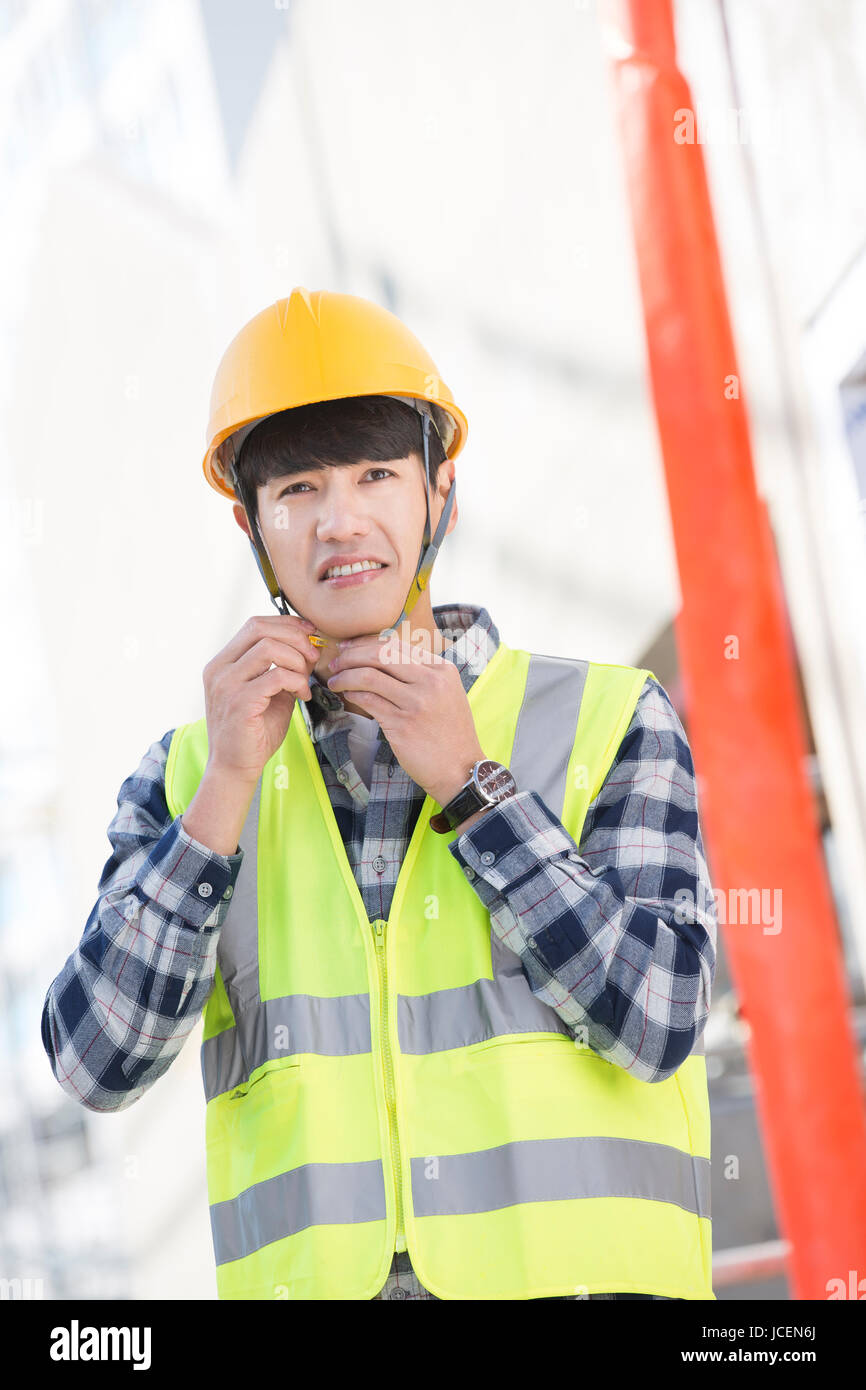 Smiling male construction worker Stock Photo - Alamy
