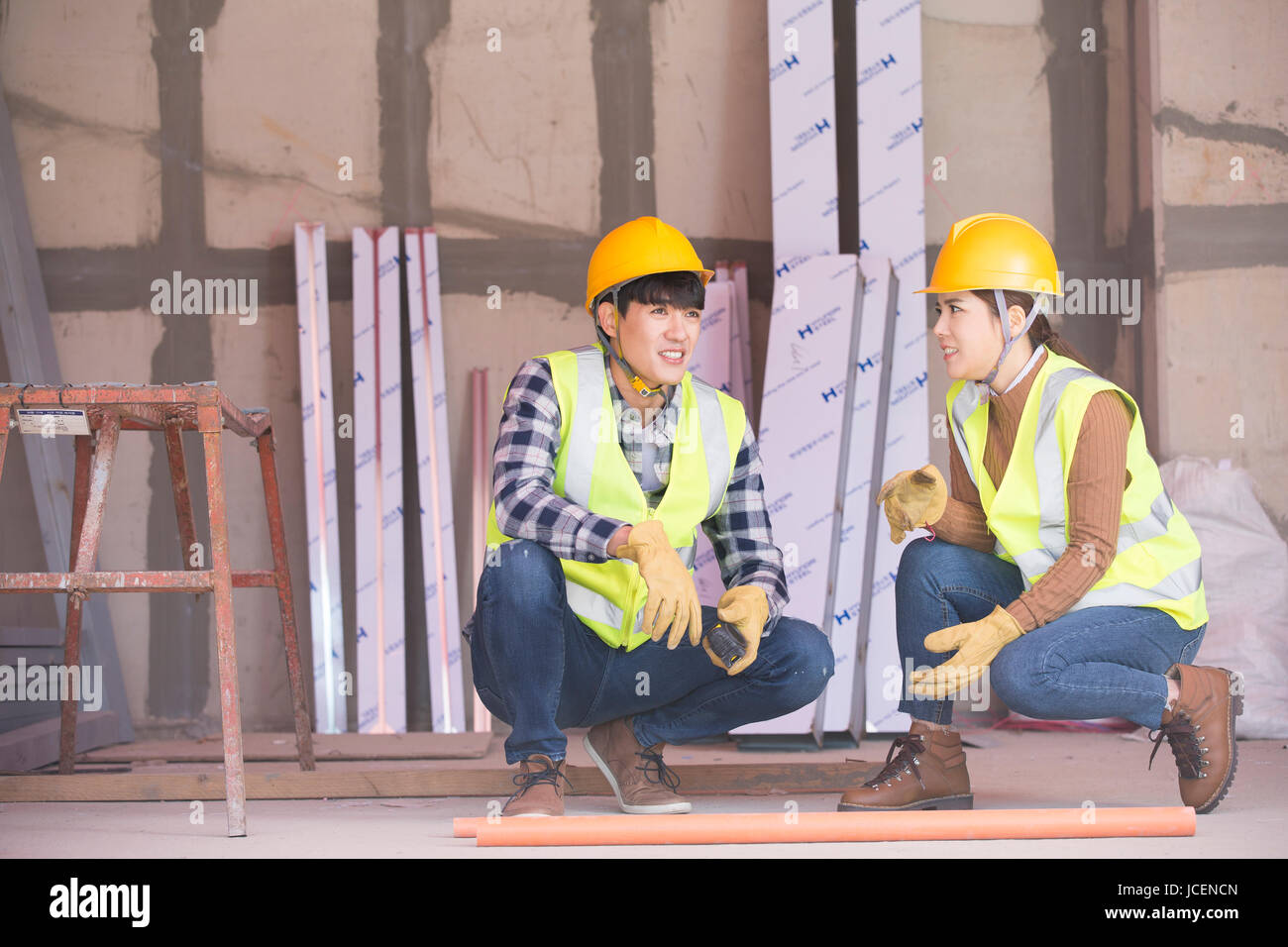 Smiling construction workers Stock Photo - Alamy