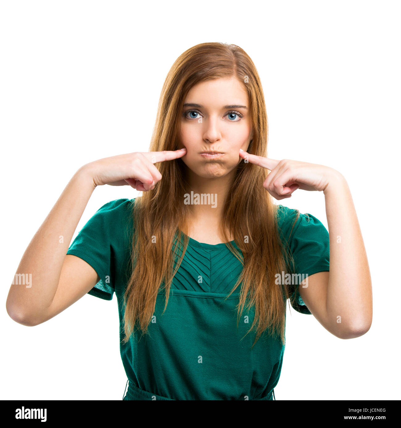 Portrait of a beautiful girl making pout isolated on white background ...