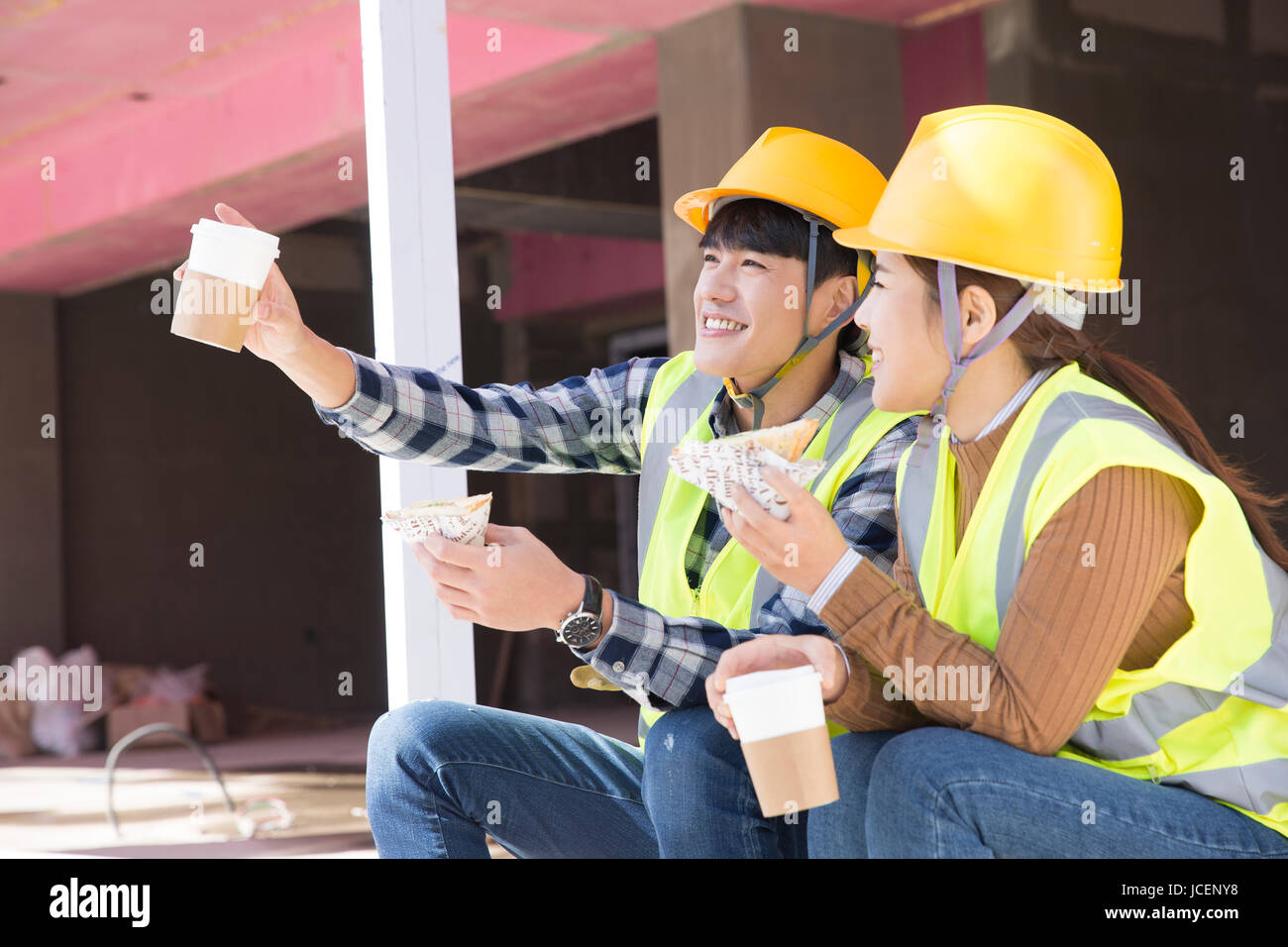 Smiling construction workers Stock Photo - Alamy