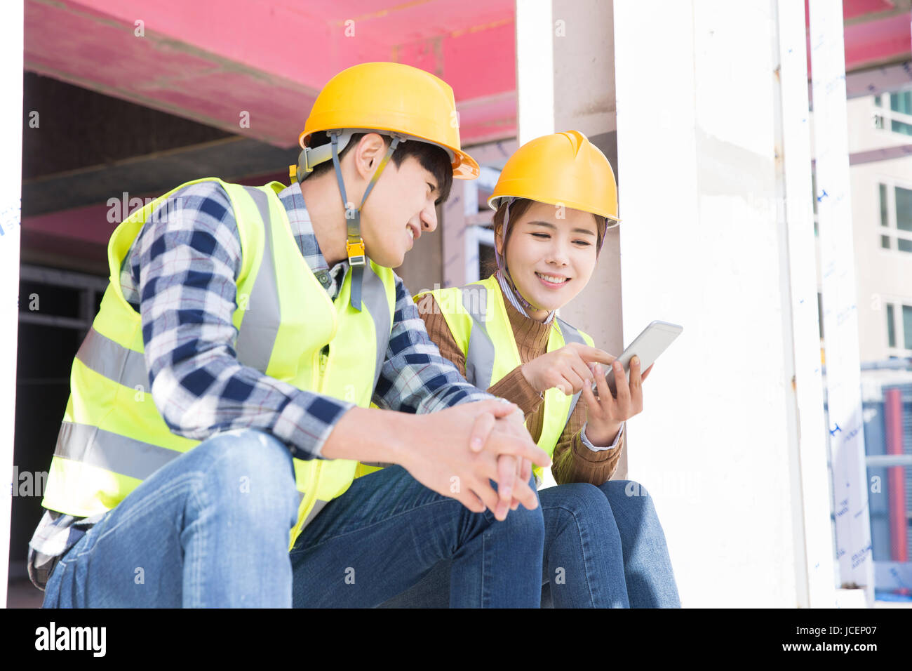 Smiling construction workers Stock Photo - Alamy
