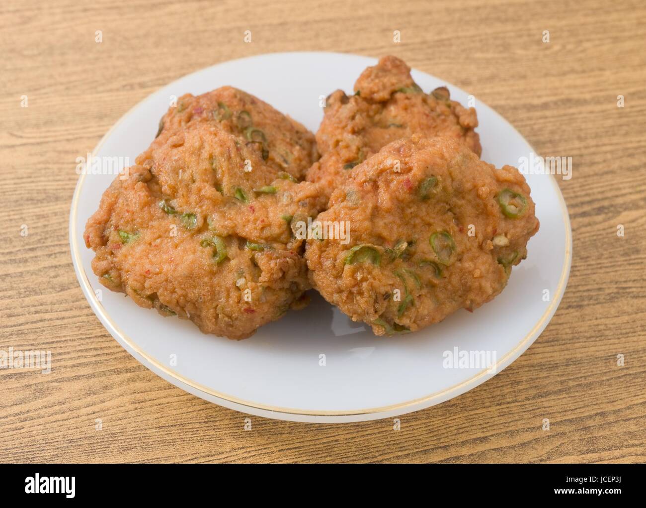 Fish cakes on brown plate hi-res stock photography and images - Alamy