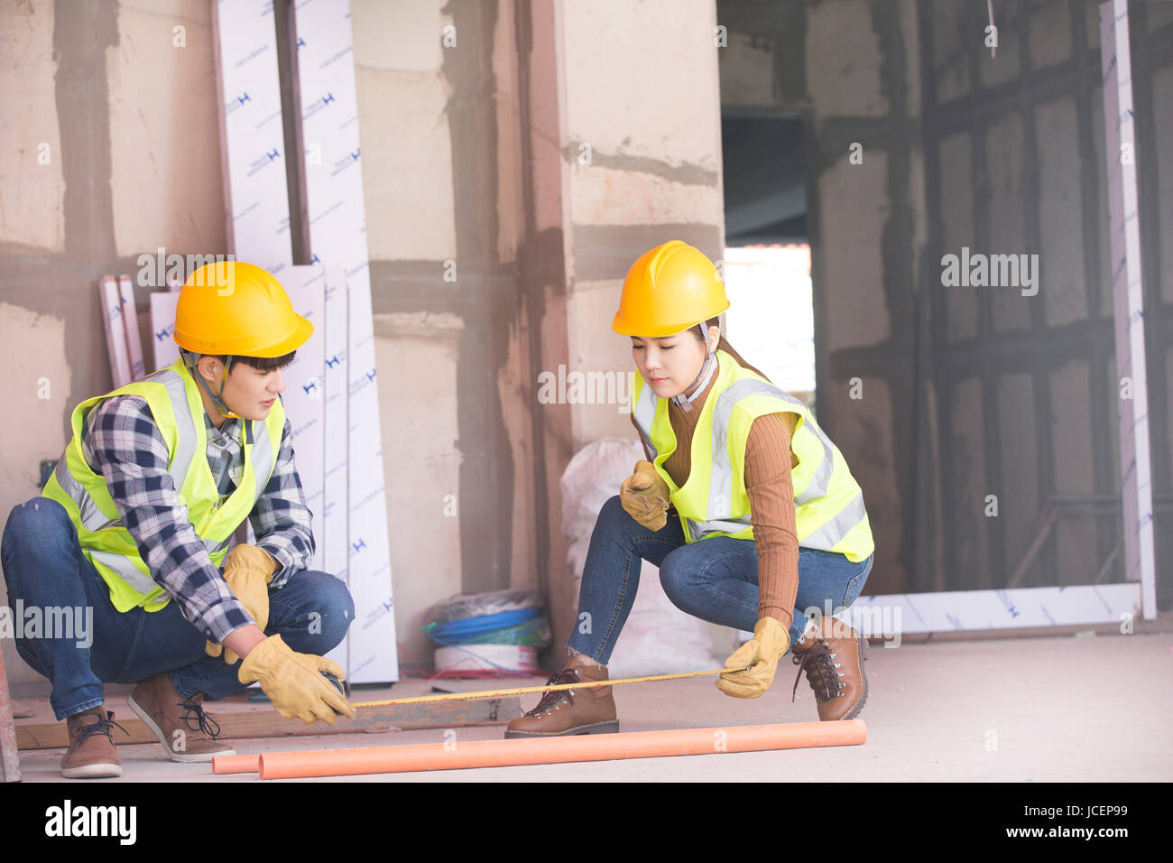 Smiling construction workers Stock Photo - Alamy